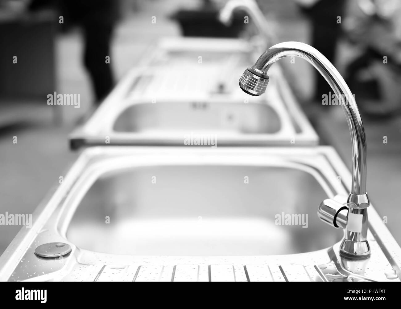 Water tap on stainless steel kitchen sink Stock Photo - Alamy