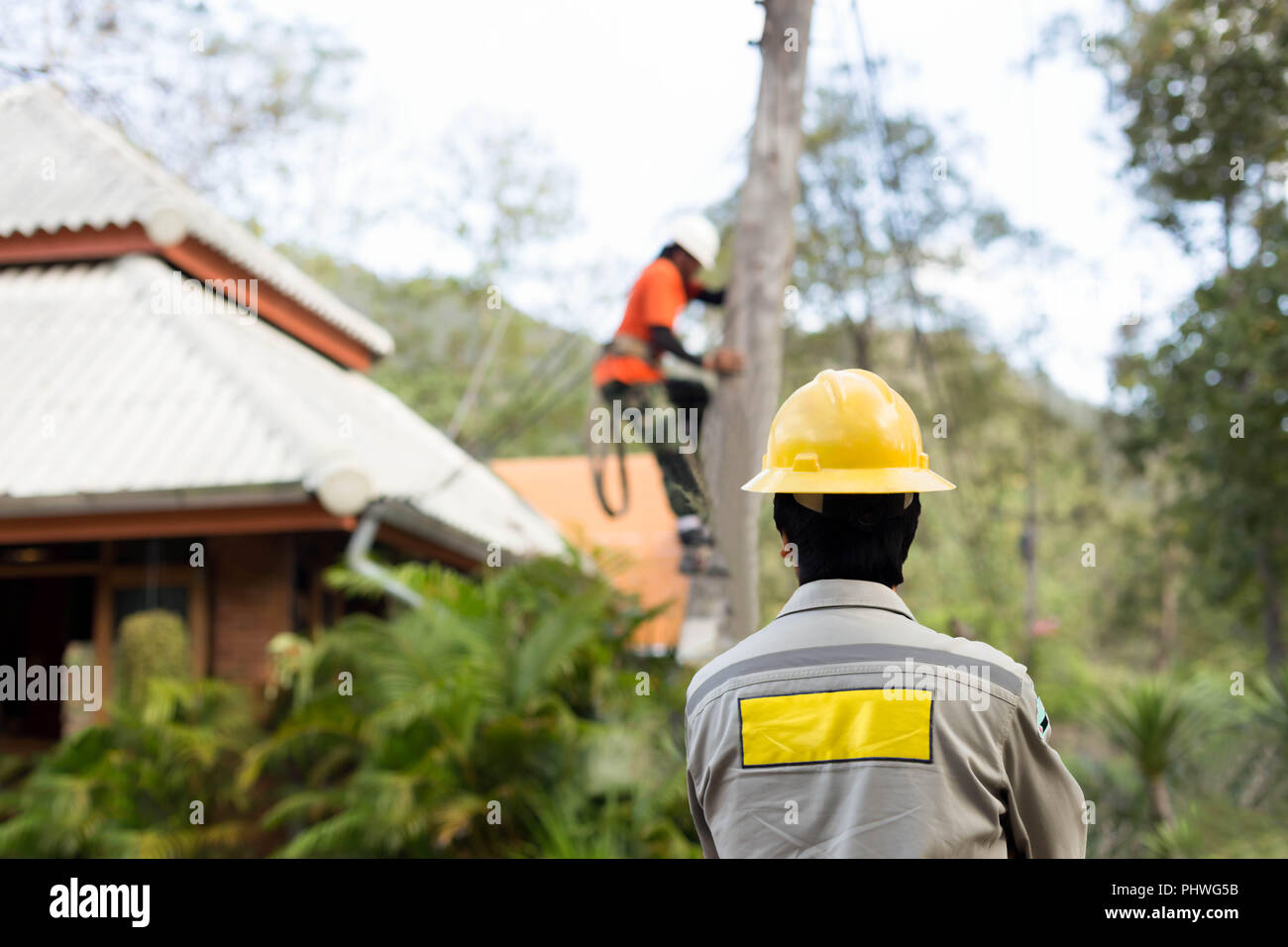 Electrician lineman repairman worker on electric post power pole Stock ...