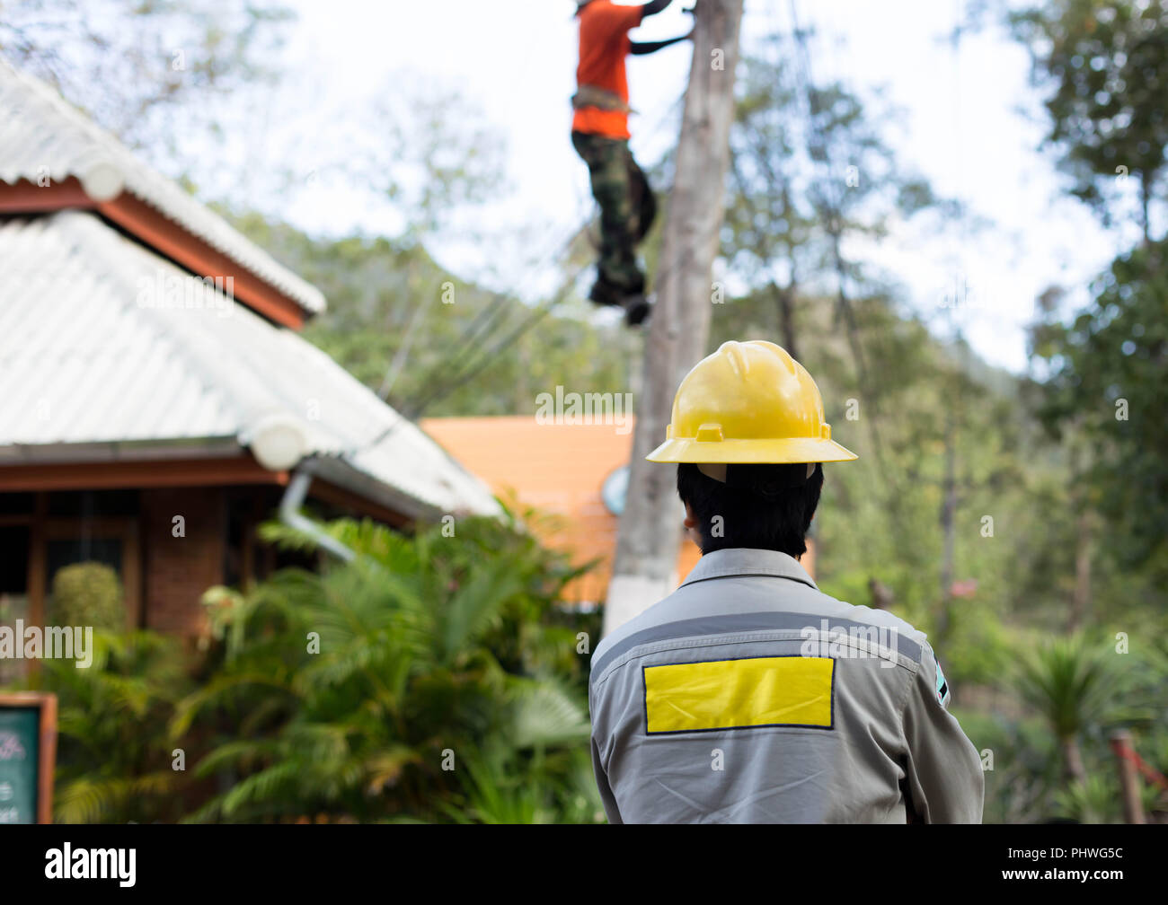 Electrician lineman repairman worker on electric post power pole Stock ...