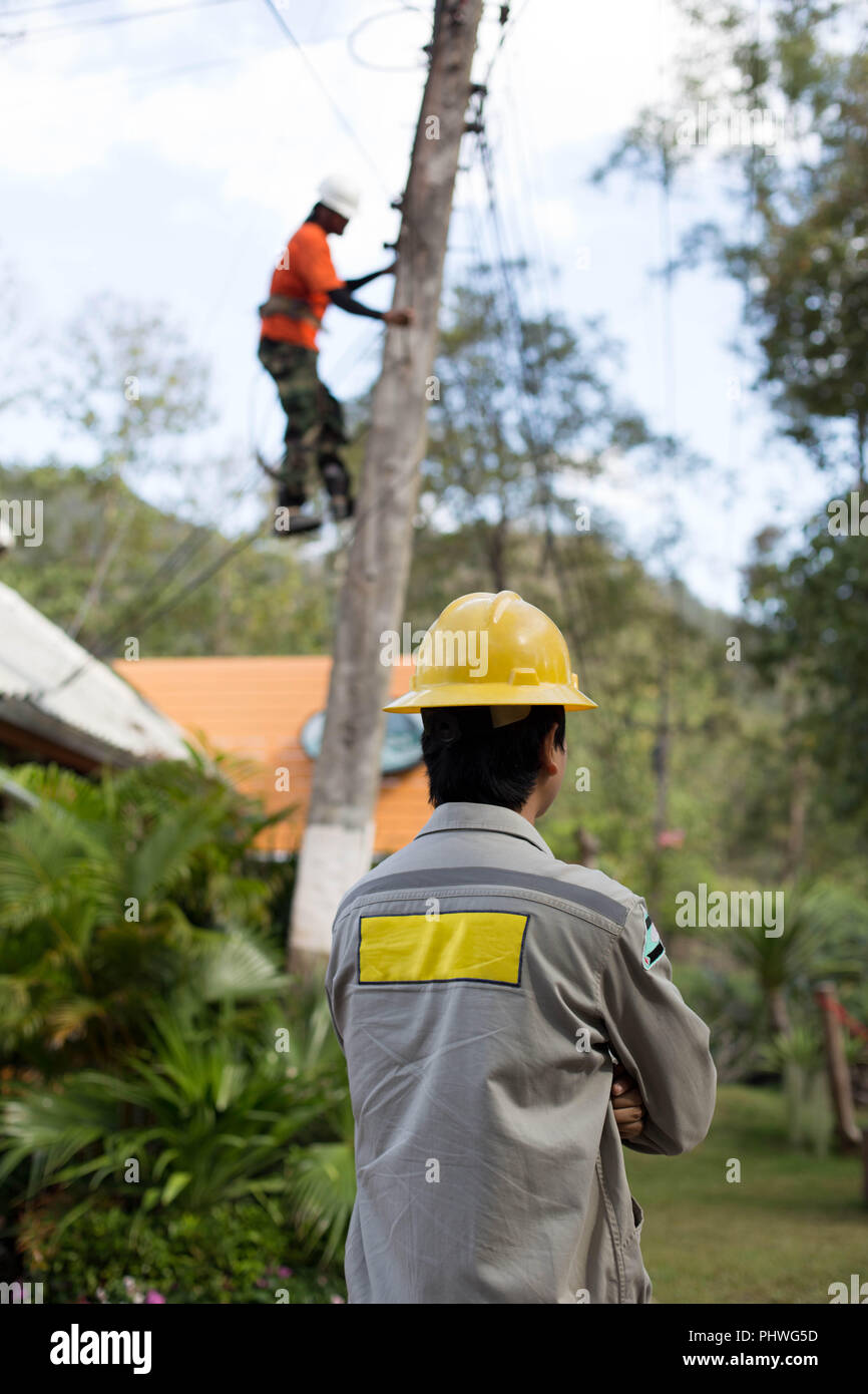 Electrician lineman repairman worker on electric post power pole Stock ...
