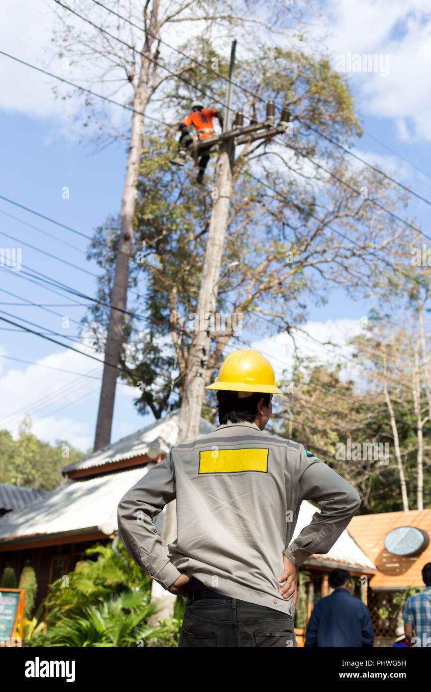 Electrician lineman repairman worker on electric post power pole Stock ...