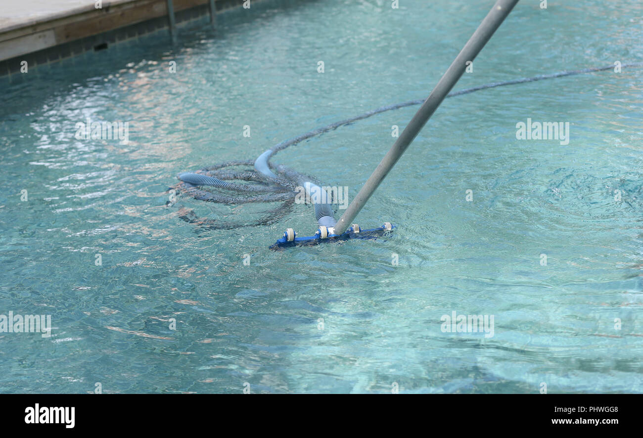Cleaning the swimming pool Stock Photo - Alamy