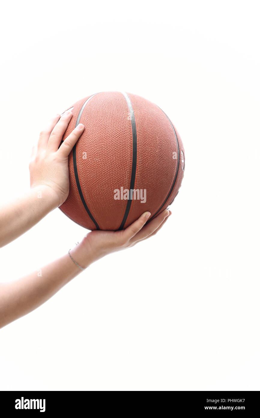 Childs Hand on basketball isolated on white background Stock Photo - Alamy
