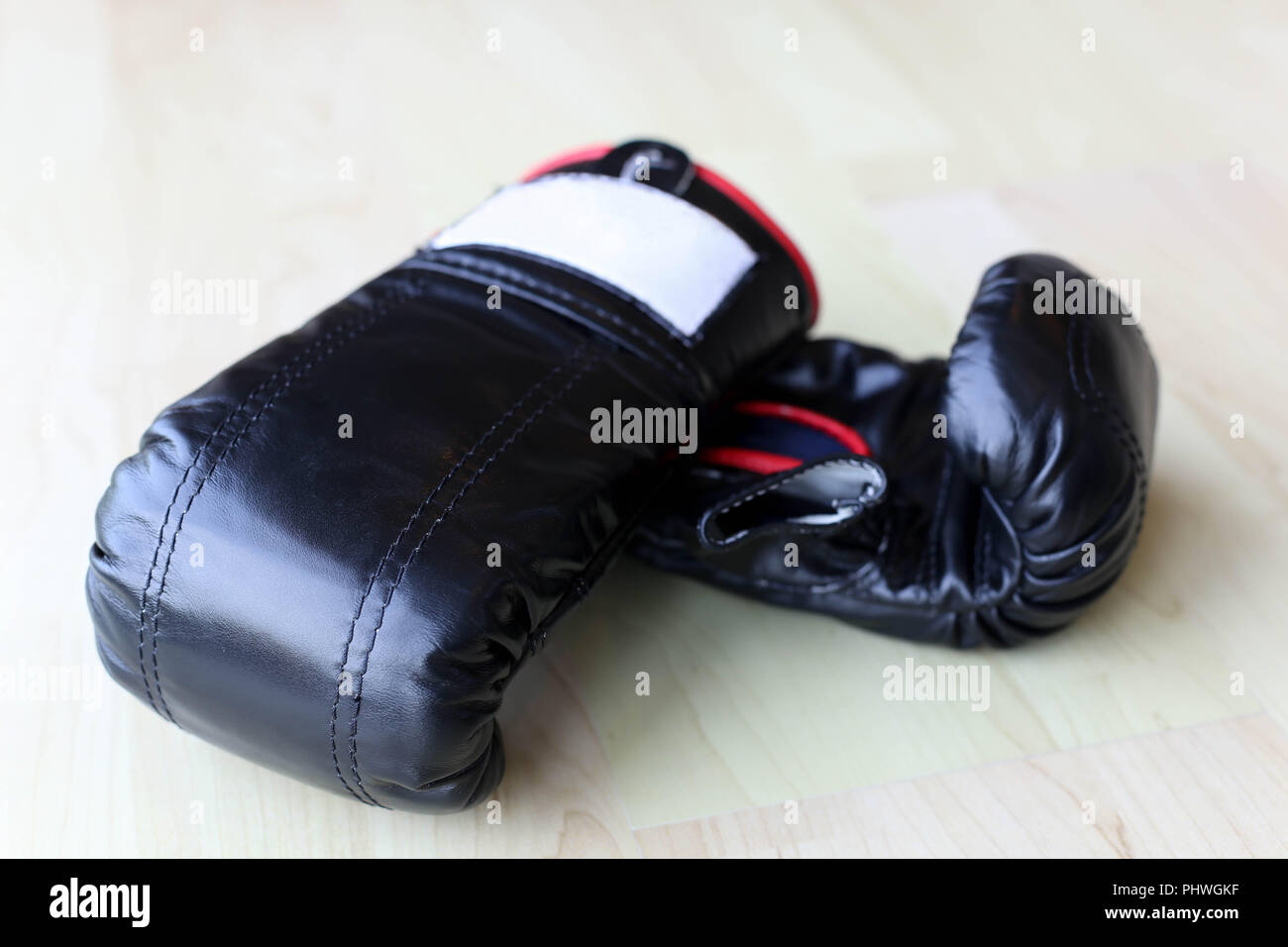 Pair of black leather boxing gloves Stock Photo - Alamy