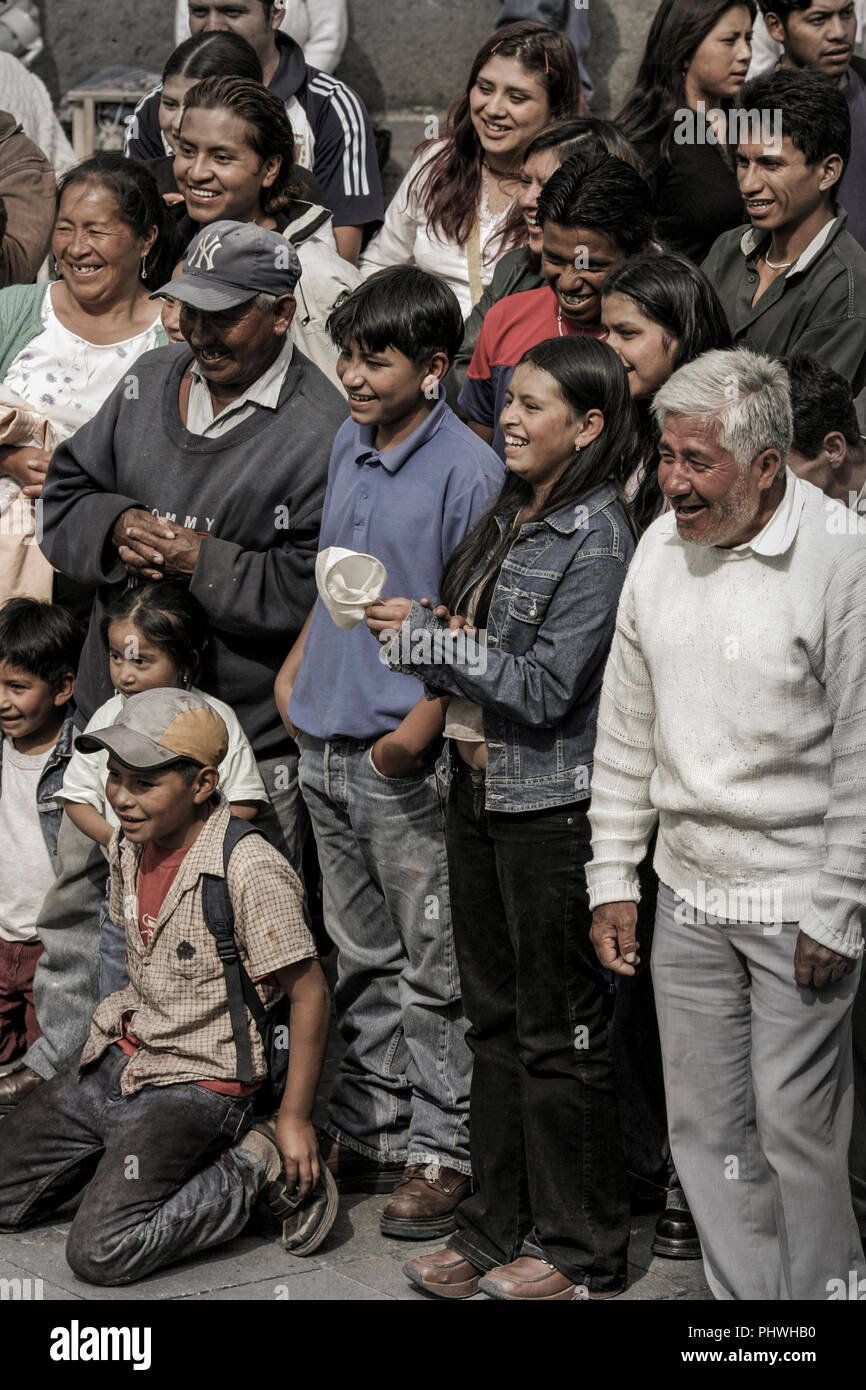 Crowd of people watching busker in a plaza of old Quito, Ecuador Stock ...