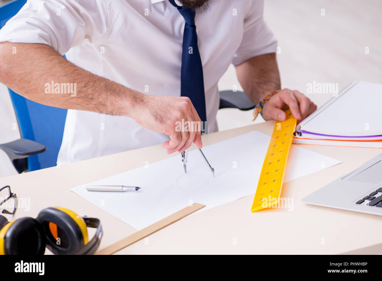 Architect working in his studio on new project Stock Photo - Alamy