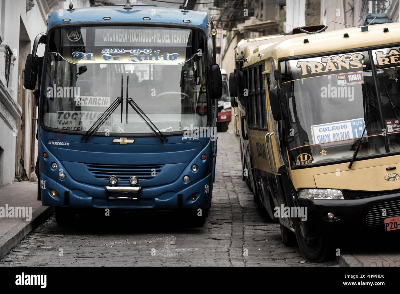 Buses in the cobblestone streets of Quito old town, Ecuador, South ...