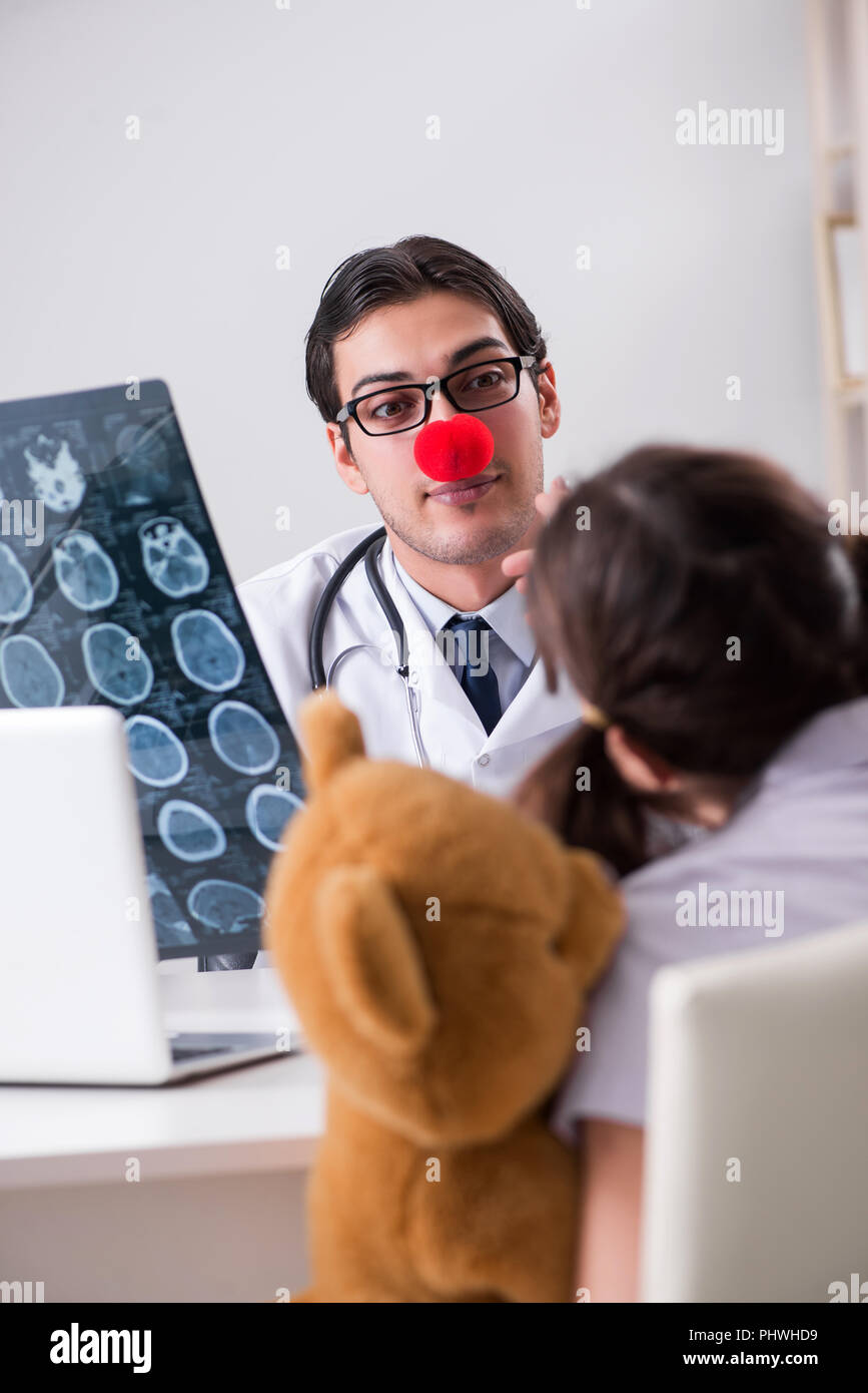Funny pediatrician with little girl at regular check-up Stock Photo - Alamy