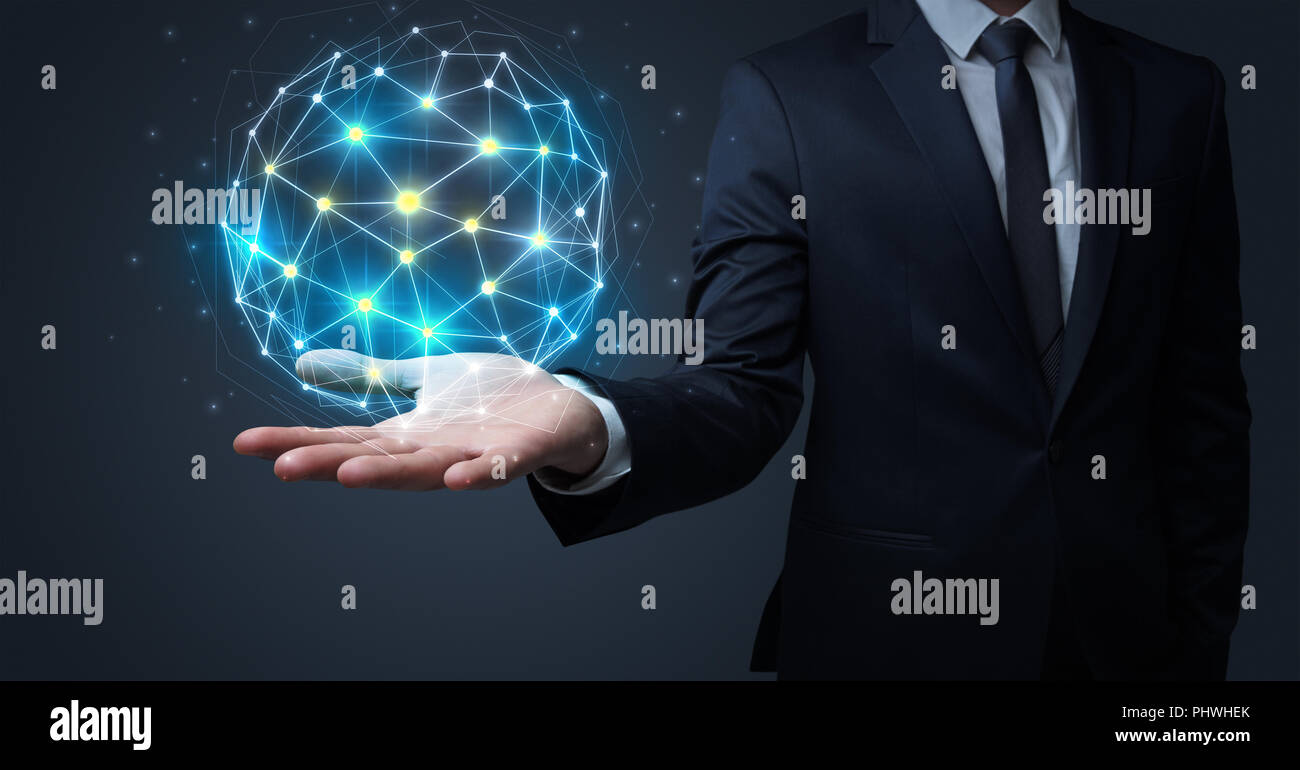 Businessman in suit holding global connection symbol on his hand Stock ...