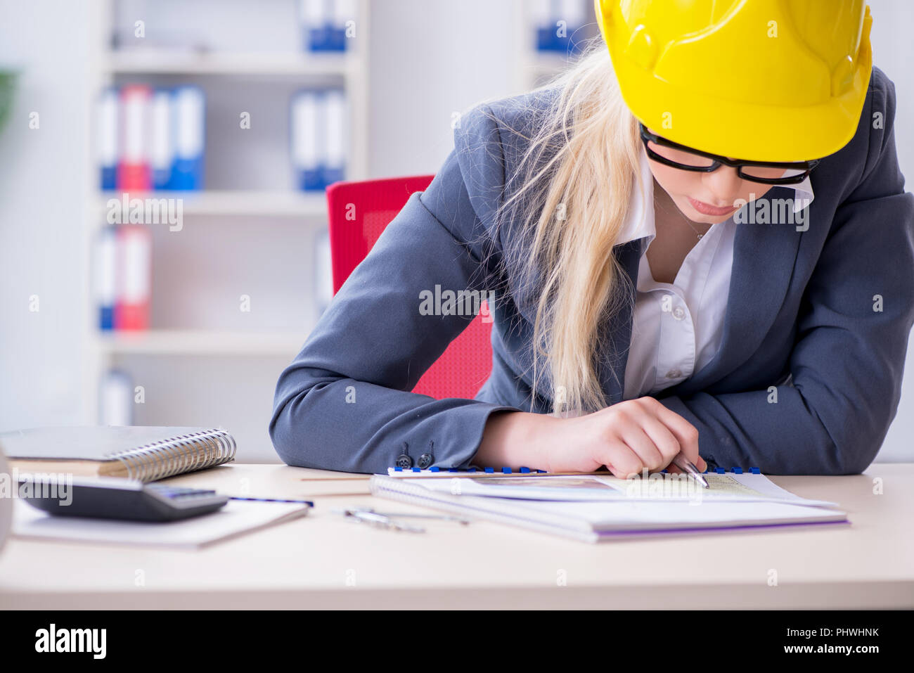 Woman architect working on the project Stock Photo - Alamy