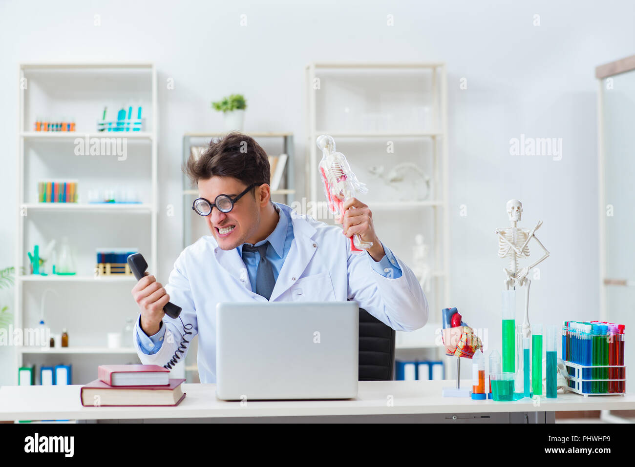 Funny doctor having fun in hospital lab Stock Photo - Alamy