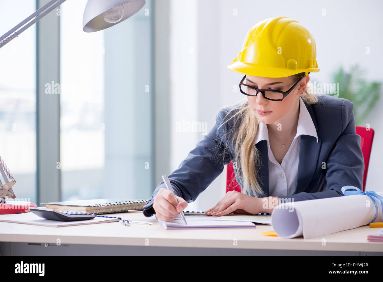 Woman architect working on the project Stock Photo - Alamy