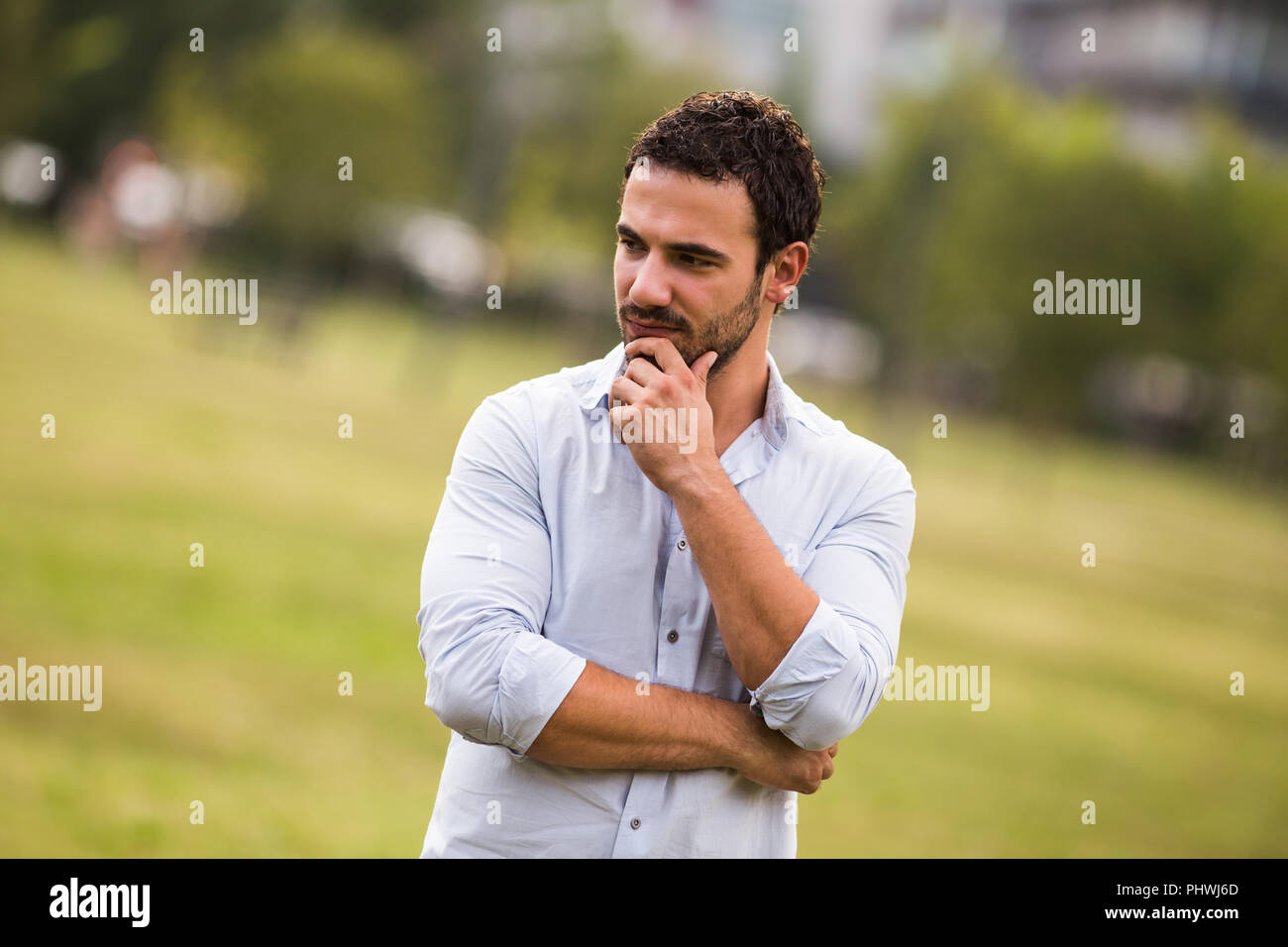 Worried businessman standing park hi-res stock photography and images ...
