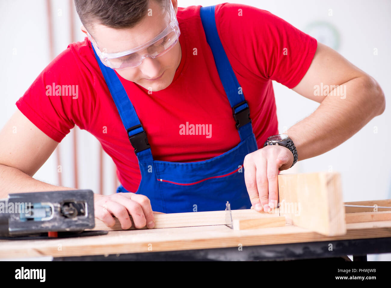 Contractor working in the workshop Stock Photo - Alamy
