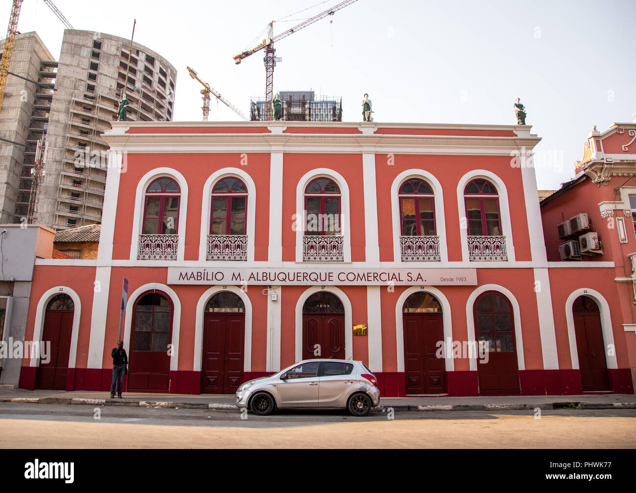 Old portuguese colonial building in front of a new skyscraper, Luanda ...