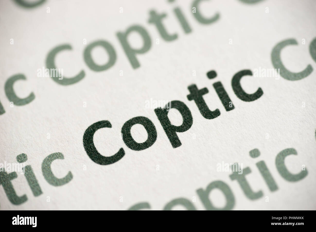 word Coptic language printed on white paper macro Stock Photo - Alamy
