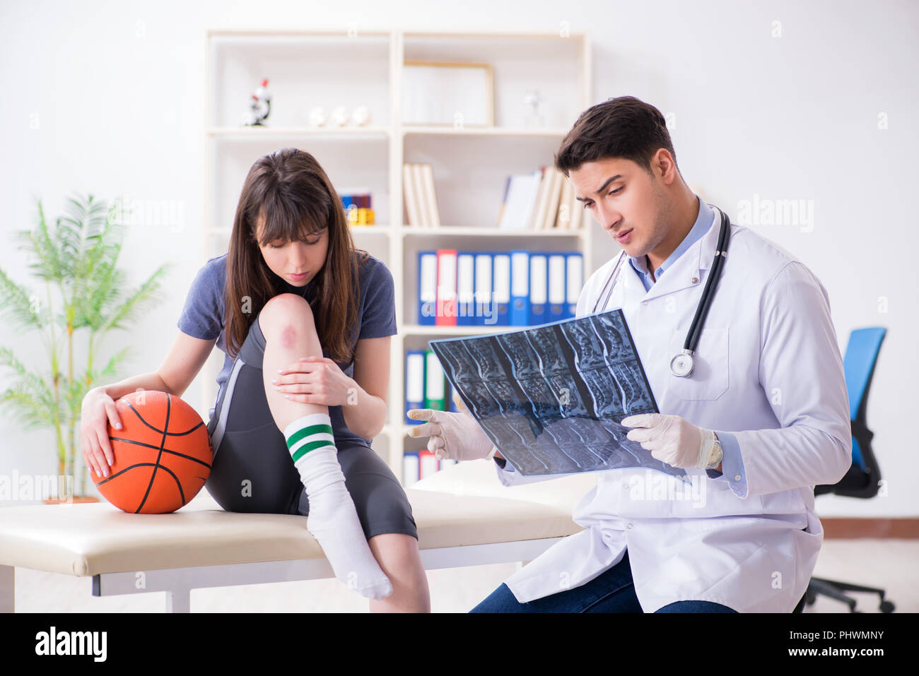 Female basketball player visiting doctor after injury Stock Photo - Alamy