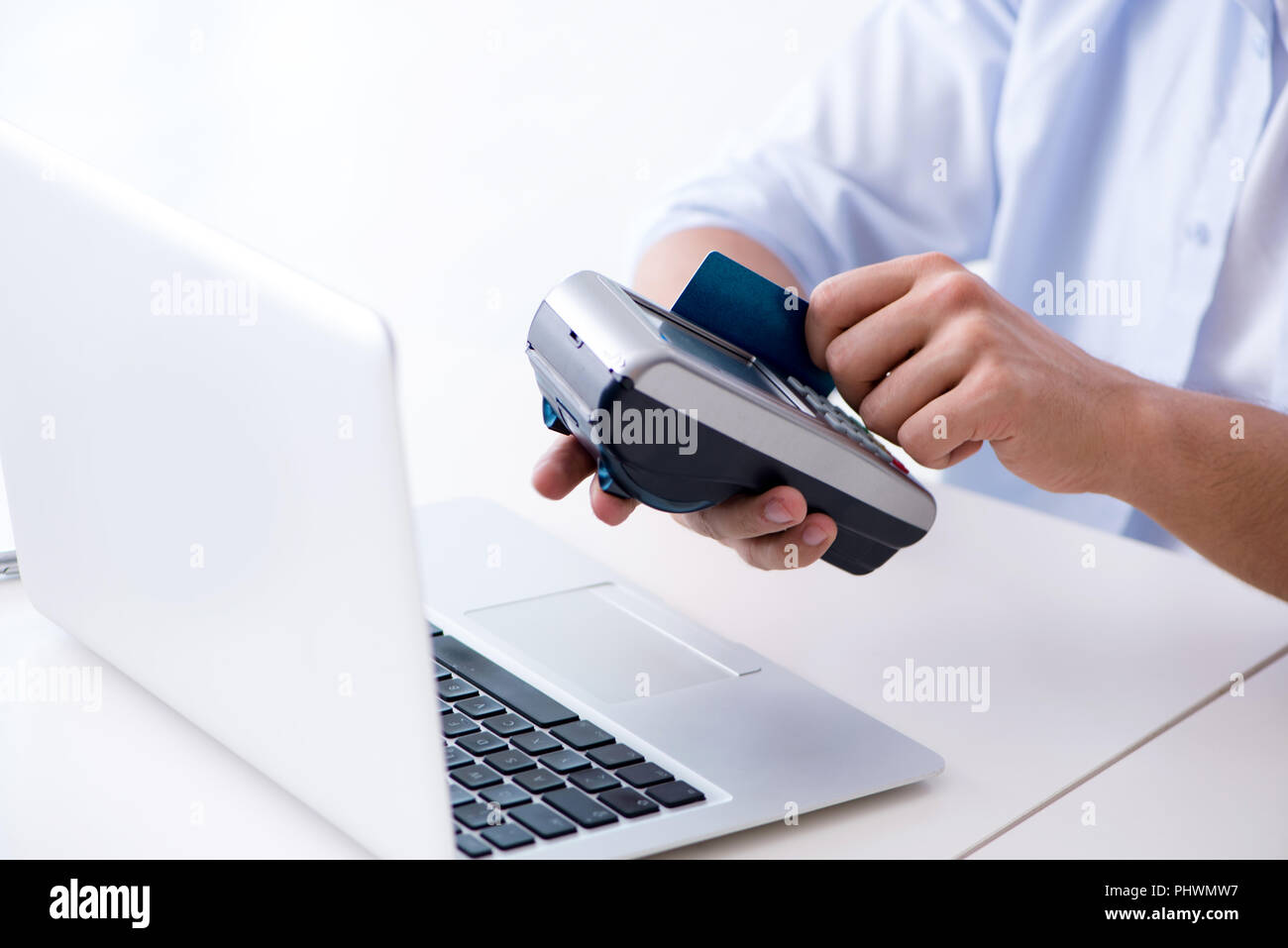 Man processing credit card transaction with POS terminal Stock Photo ...