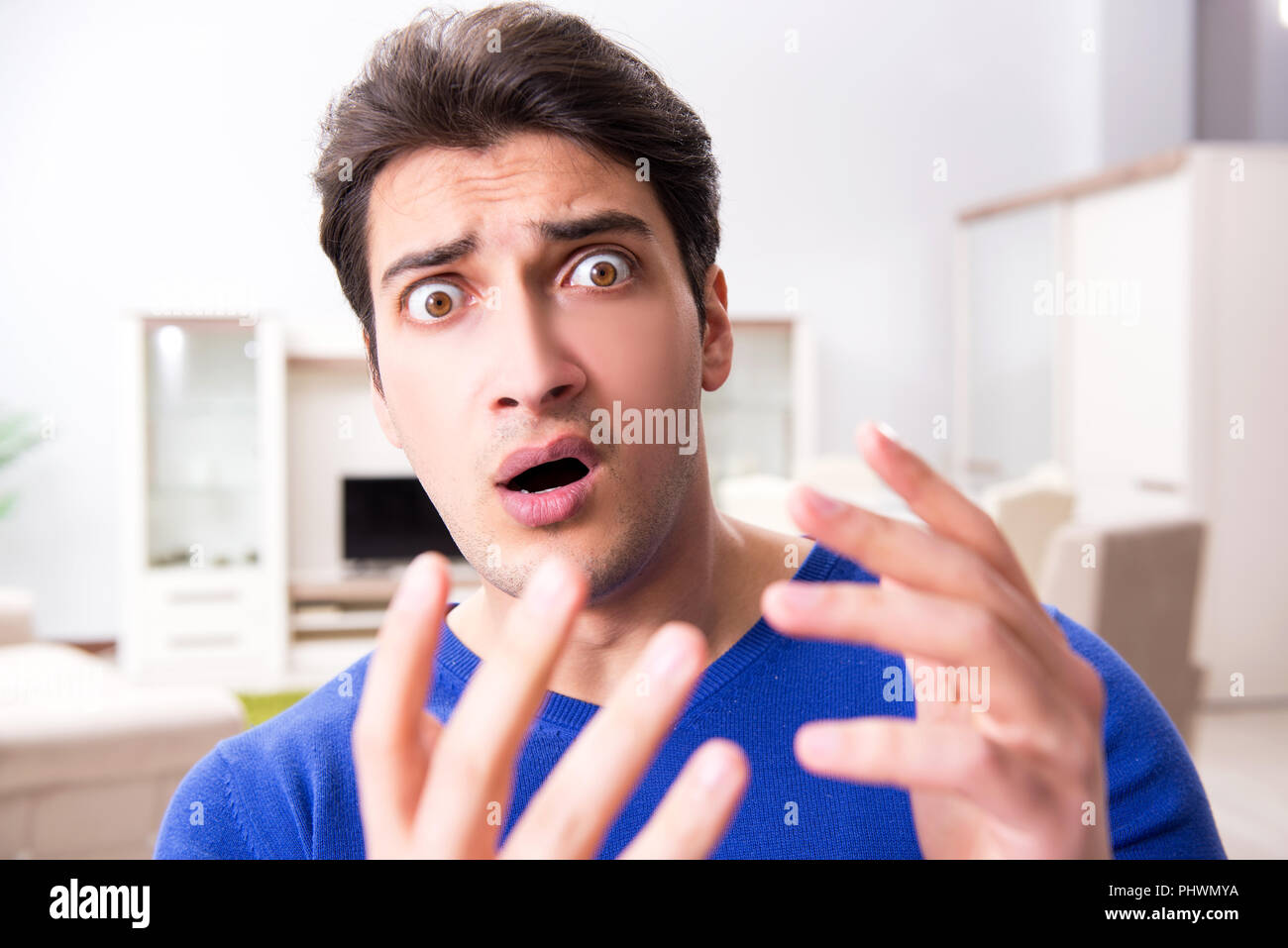 Shocked young man panicking hi-res stock photography and images - Alamy