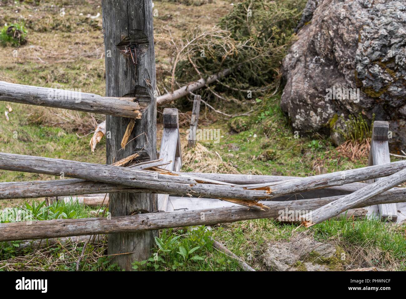 Giant stone boulder on a pasture and destroyed wooden fence, Austria ...