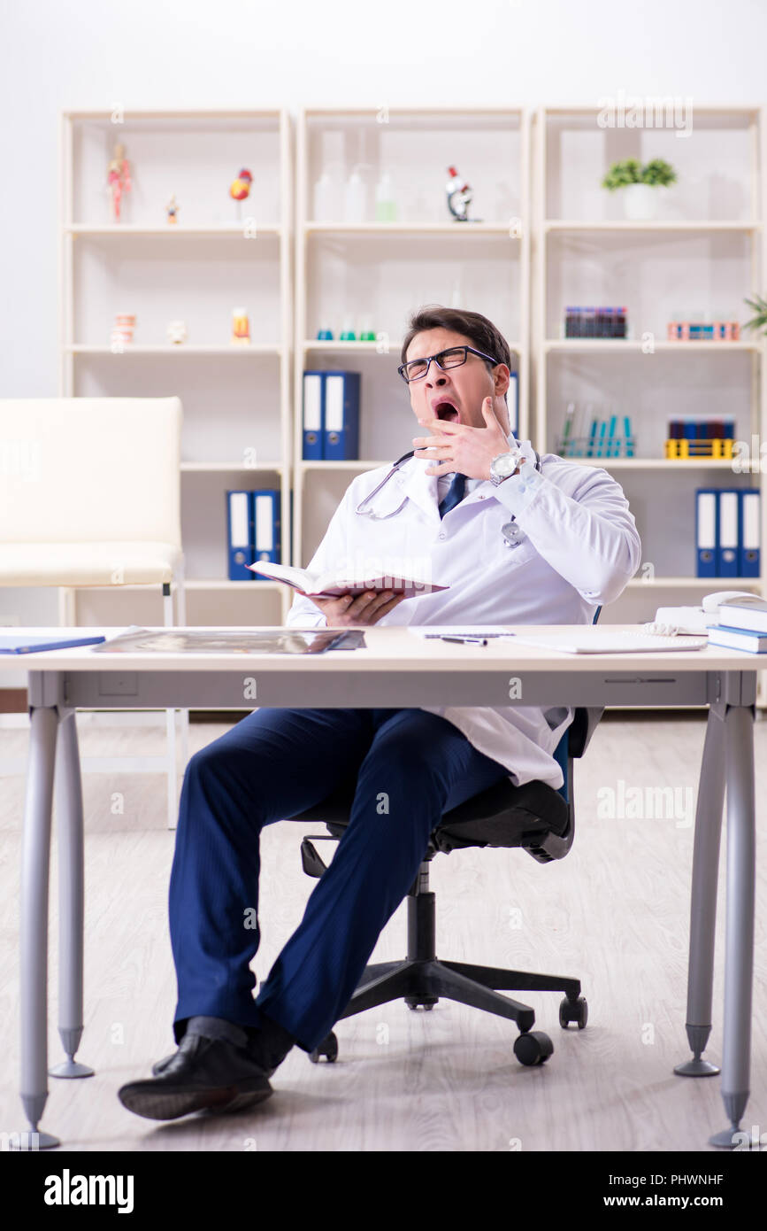 Doctor yawning hi-res stock photography and images - Alamy