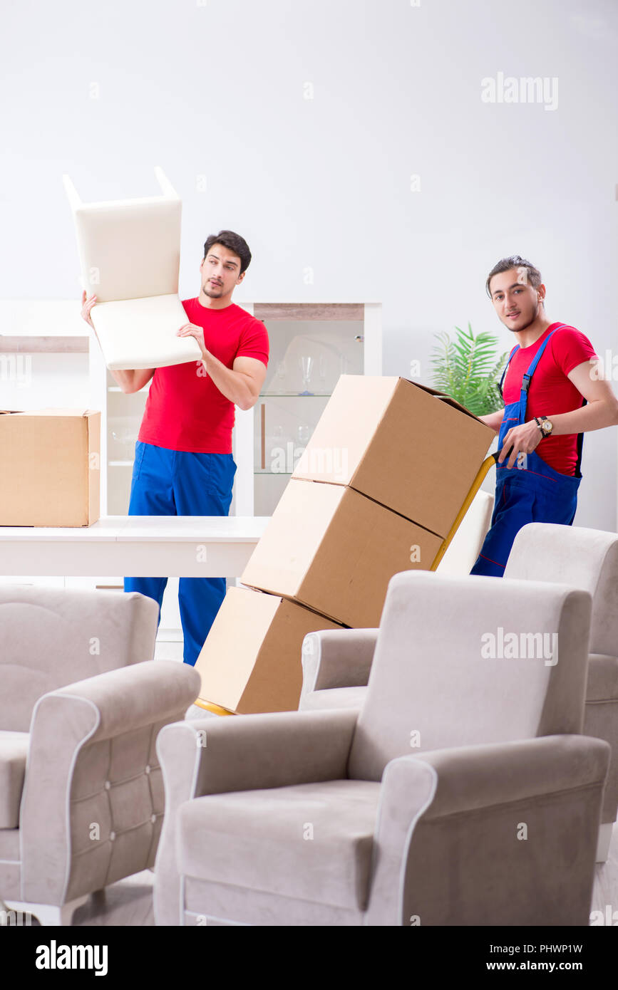 Two contractor employees moving personal belongings Stock Photo - Alamy