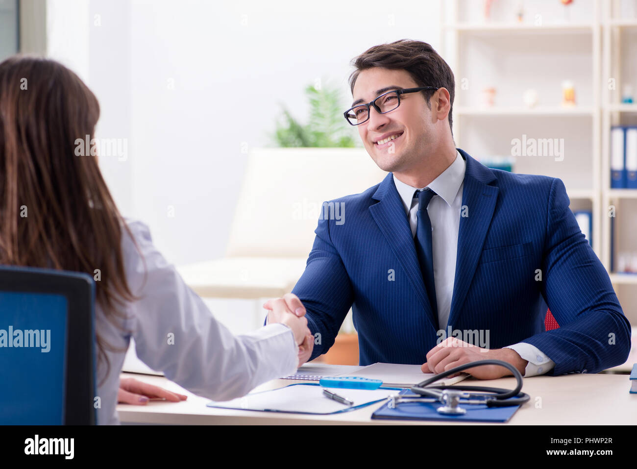 Man signing medical insurance contract Stock Photo - Alamy