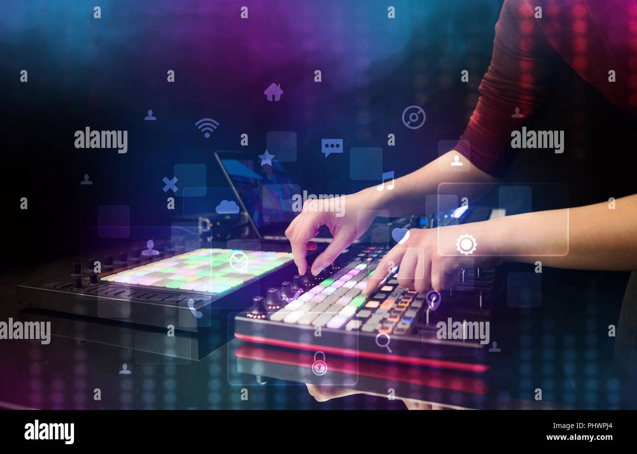 Hand mixing music on dj controller with social media concept icons ...