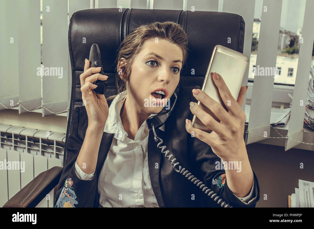business lady speaks simultaneously on three phones Stock Photo - Alamy