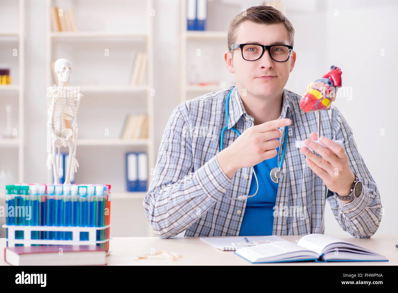 Medical student studying heart in classroom during lecture Stock Photo ...