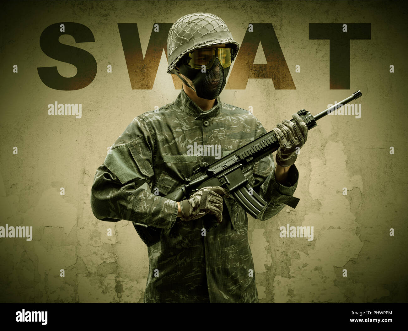 Uniformed armed soldier with damaged wall background Stock Photo - Alamy