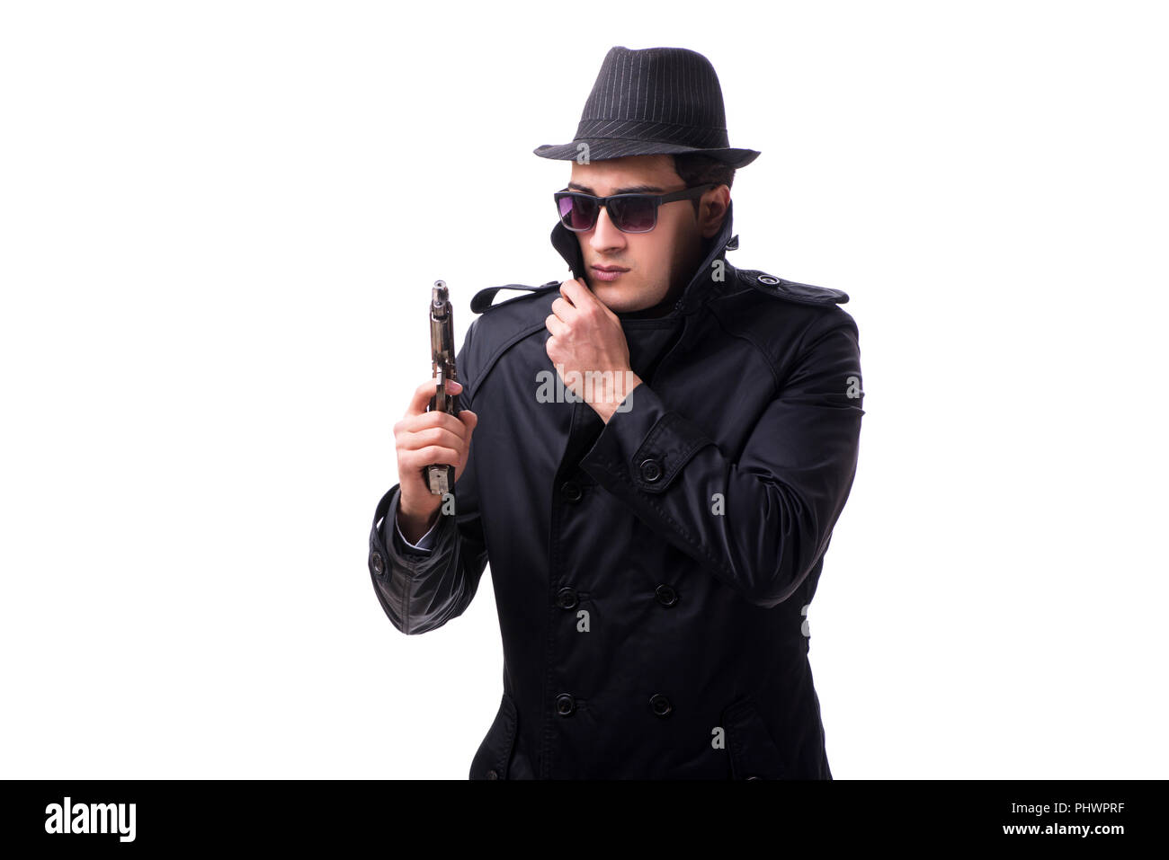 Man spy with handgun isolated on white background Stock Photo - Alamy