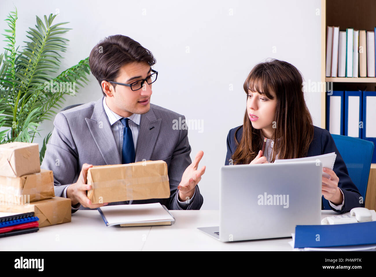 Business people receiving new mail and parcels Stock Photo - Alamy