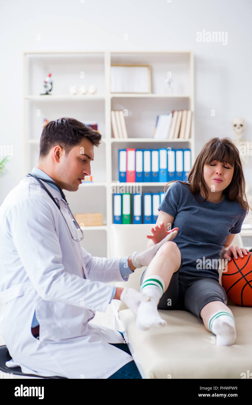 Female basketball player visiting doctor after injury Stock Photo - Alamy