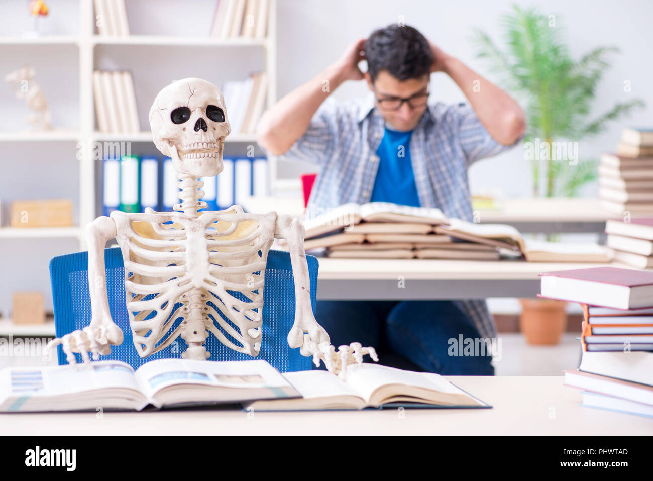 Student skeleton listening to lecture in classroom Stock Photo - Alamy