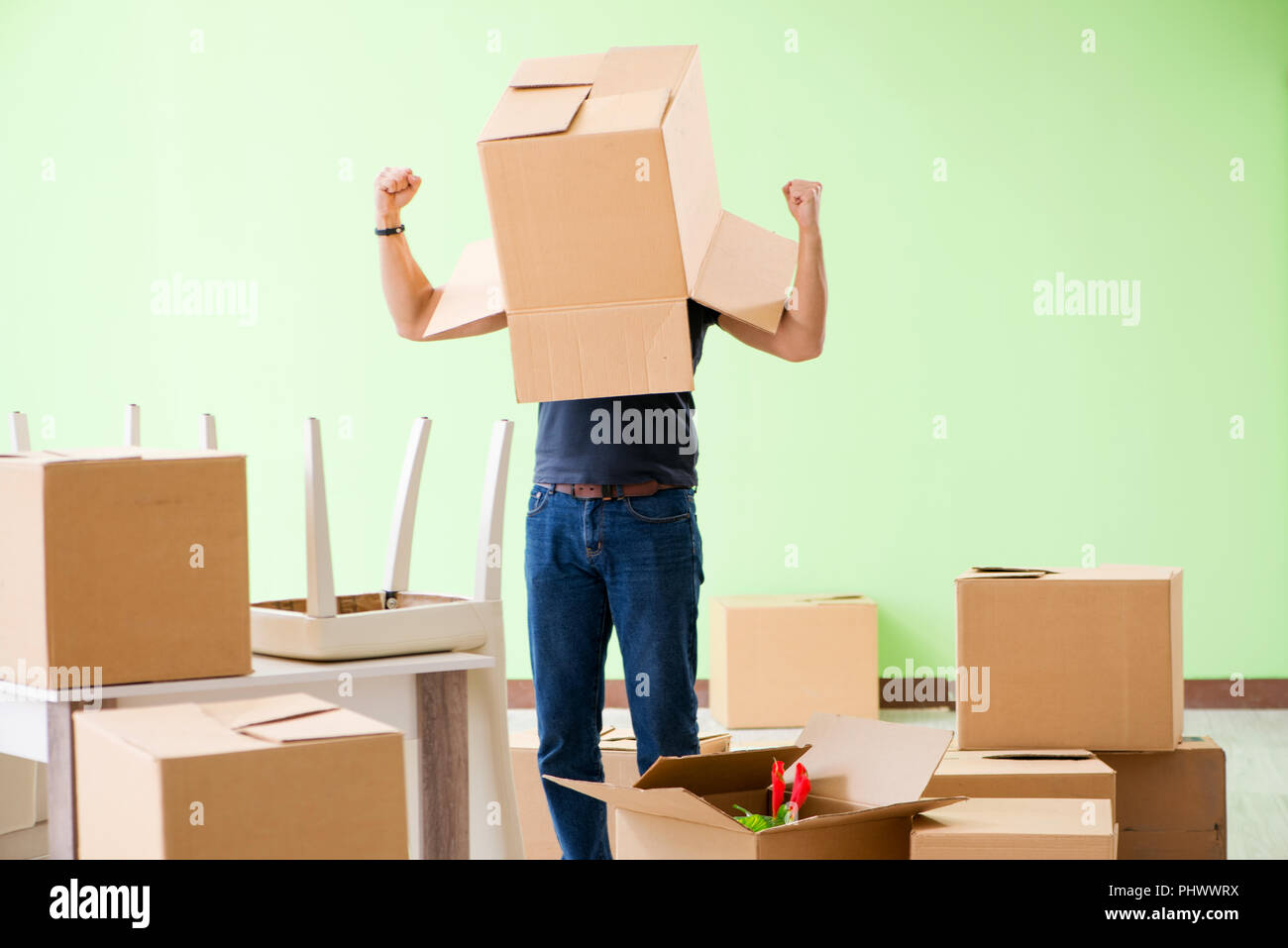 Man moving house with boxes Stock Photo - Alamy