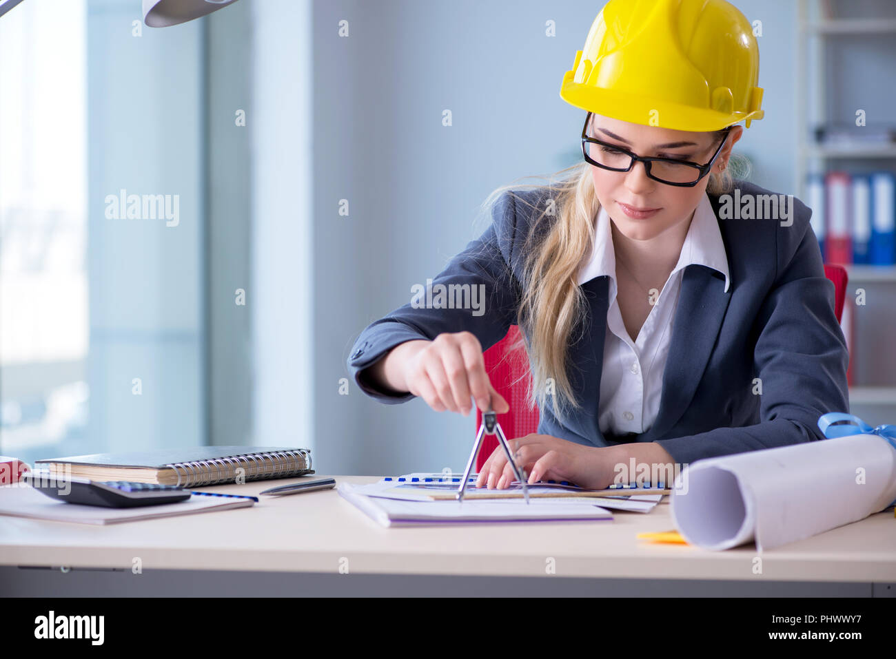 Woman architect working on the project Stock Photo - Alamy