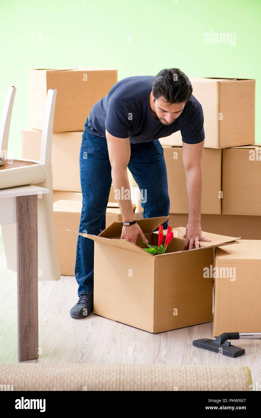 Man moving house with boxes Stock Photo - Alamy