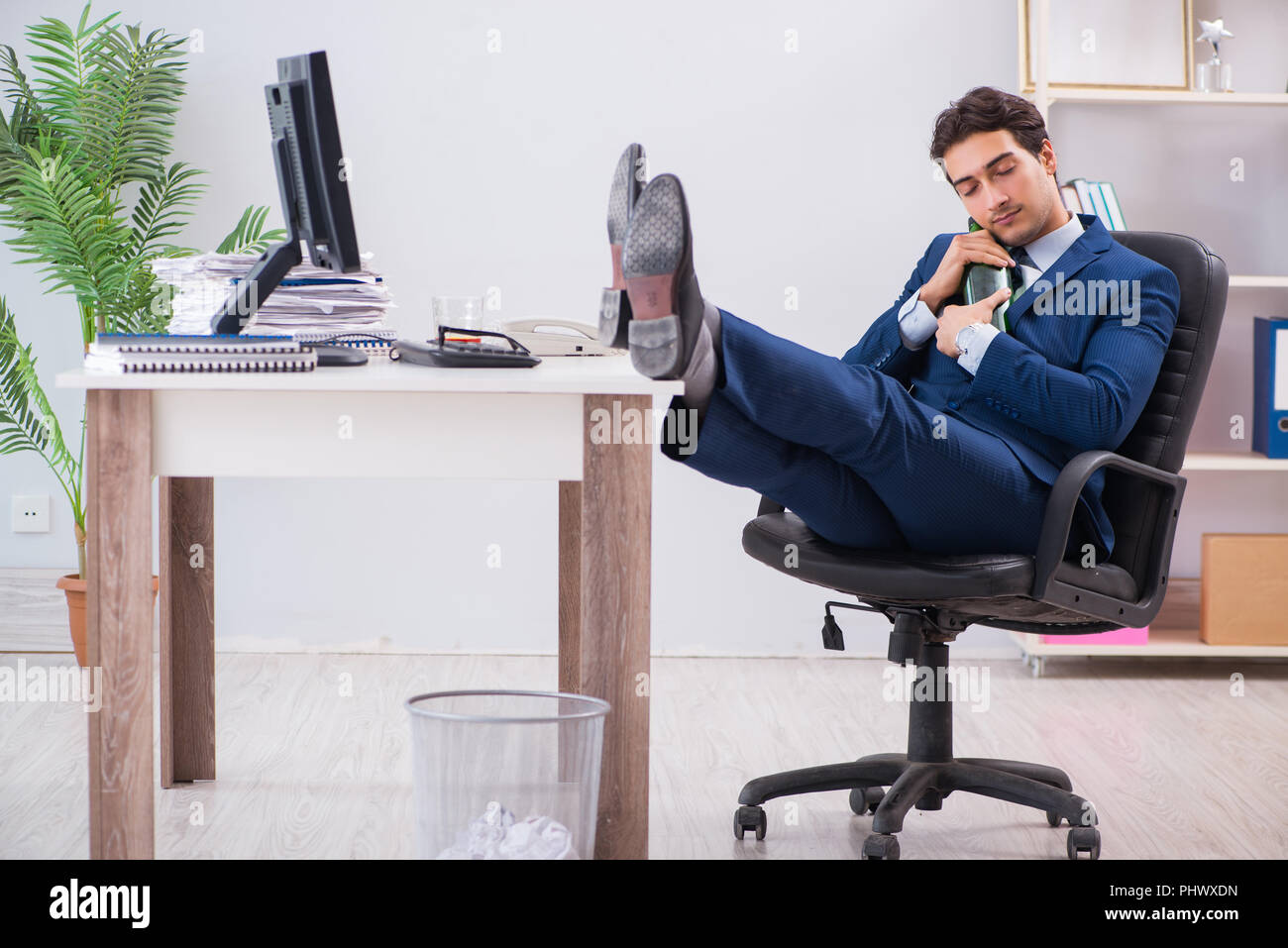 Young drunk employee in the office hi-res stock photography and images ...