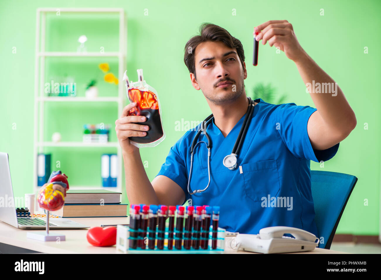 Doctor doing blood analysis in the lab Stock Photo - Alamy