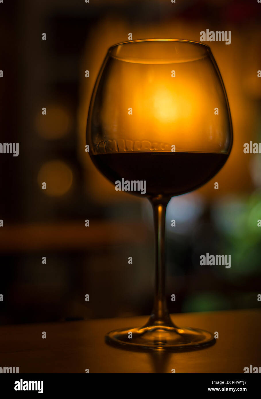 glass of french merlot red wine in dark cozy bar interior Stock Photo ...
