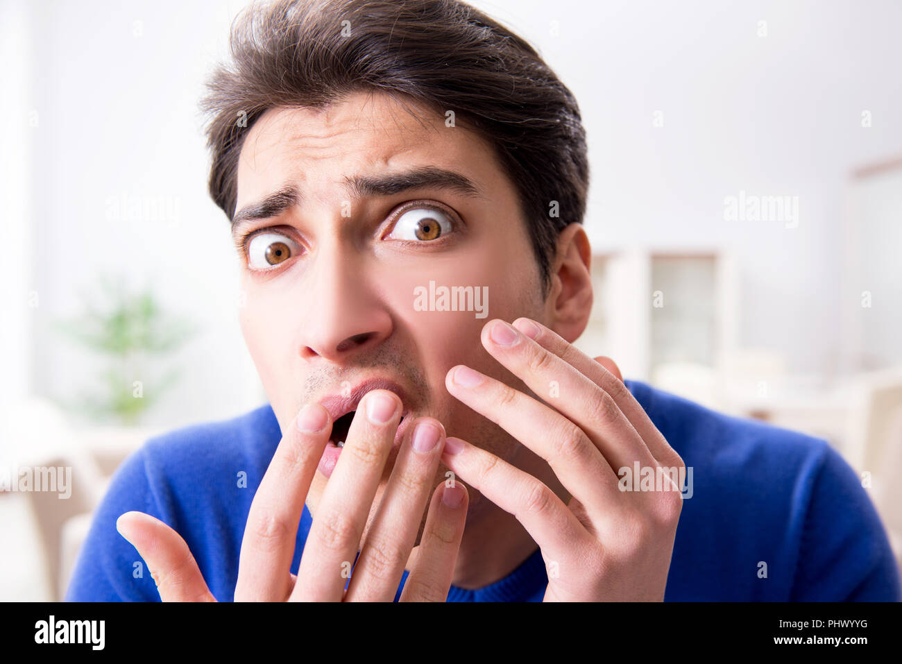 Man panicking because of pimples on the skin Stock Photo - Alamy