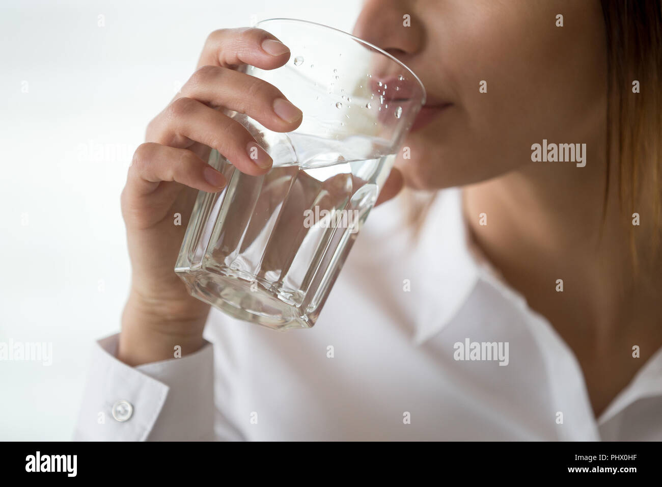 Dehydrated woman feeling thirsty holding glass drinking water, h Stock ...