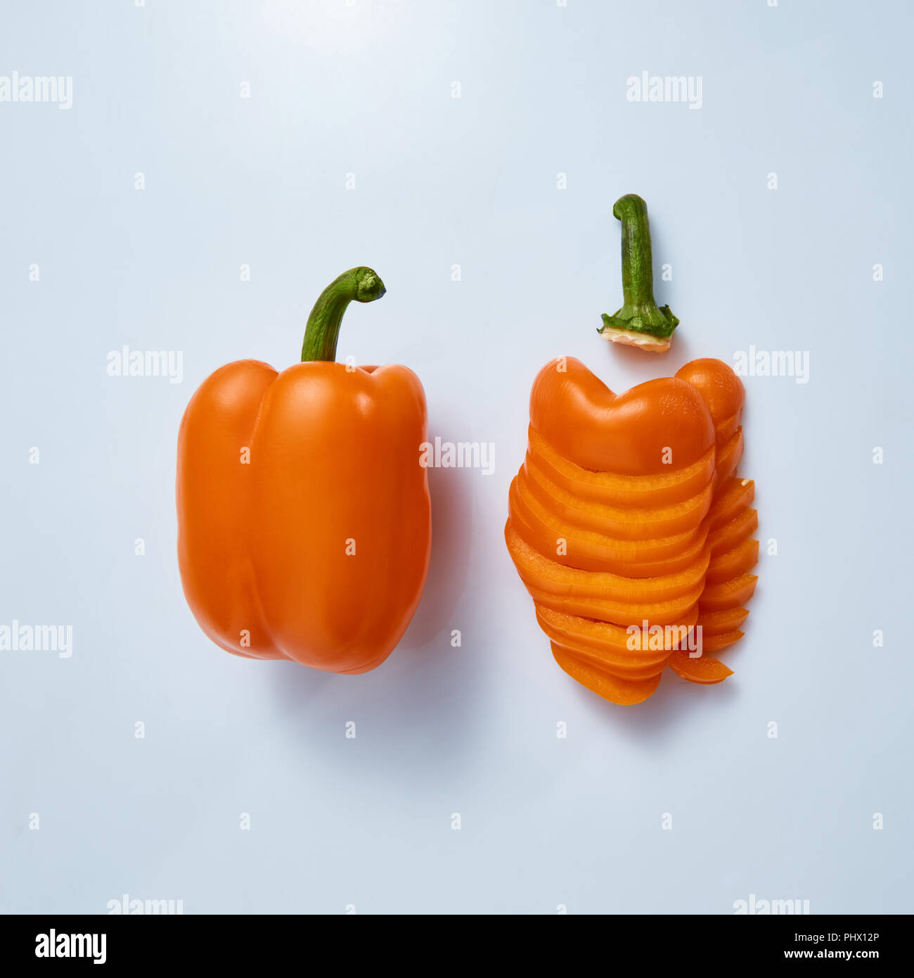 Yellow pepper half and chopped into pieces on gray background Stock ...