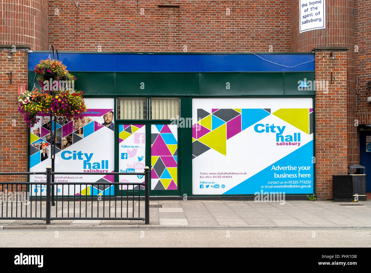 Salisbury City Hall frontage with colourful advertising panels and ...