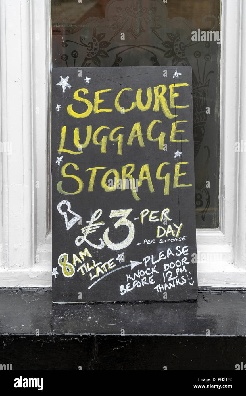 Secure luggage storage advertising sign Stock Photo - Alamy