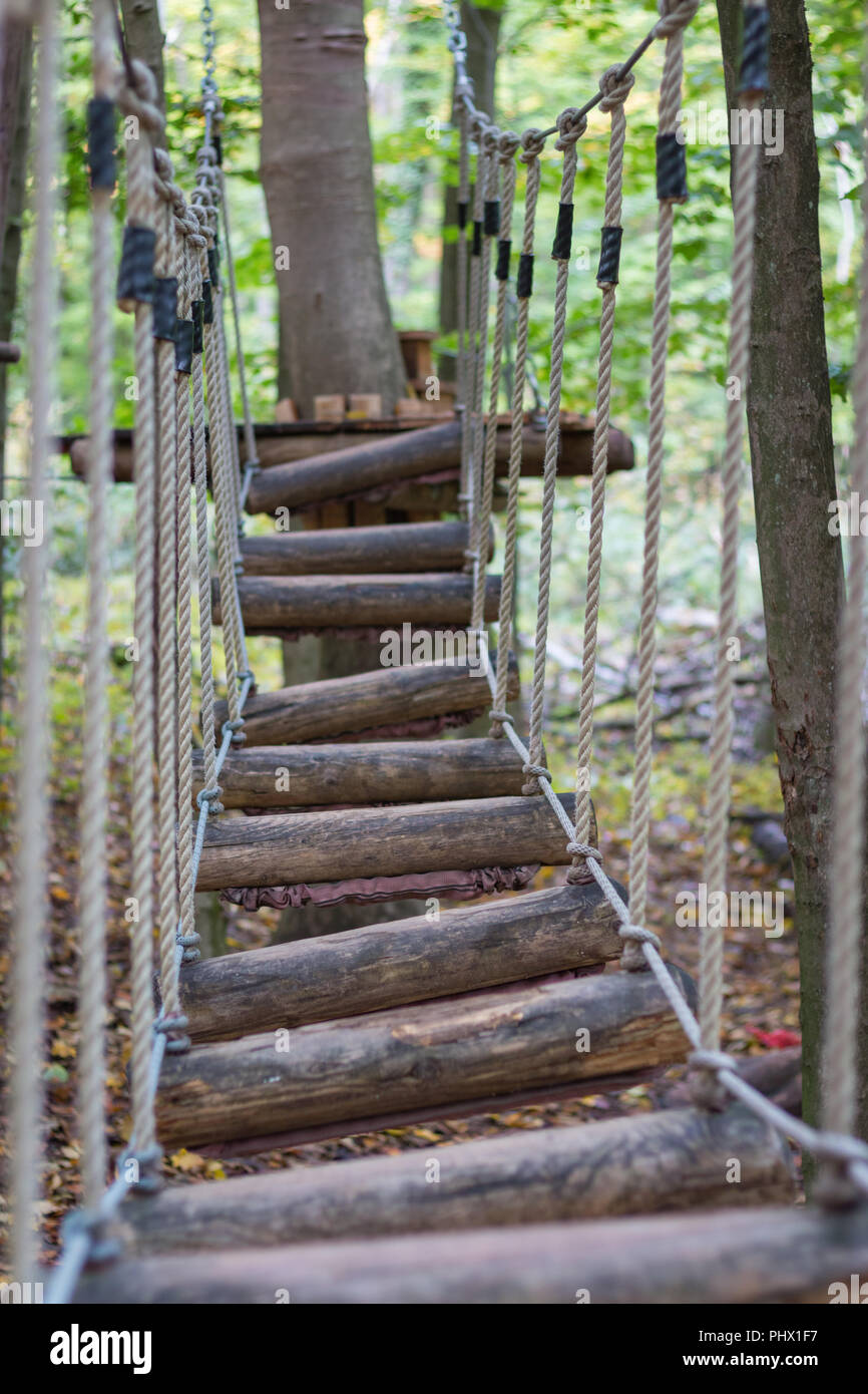 Rope bridge at adventure climbing park with focus on foreground Stock ...