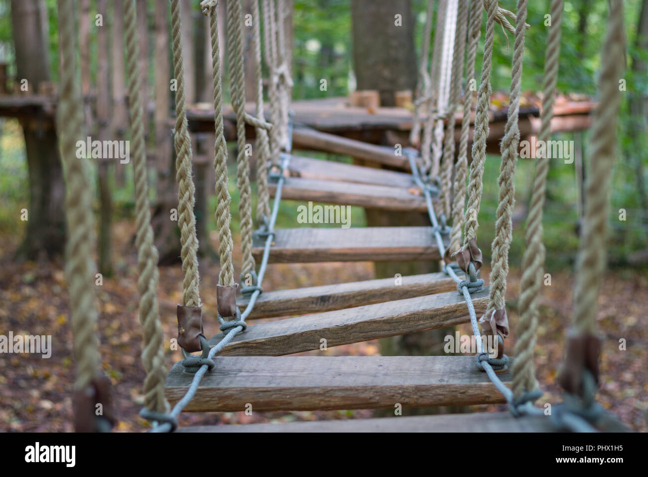 Rope bridge at adventure climbing park with natural background Stock ...