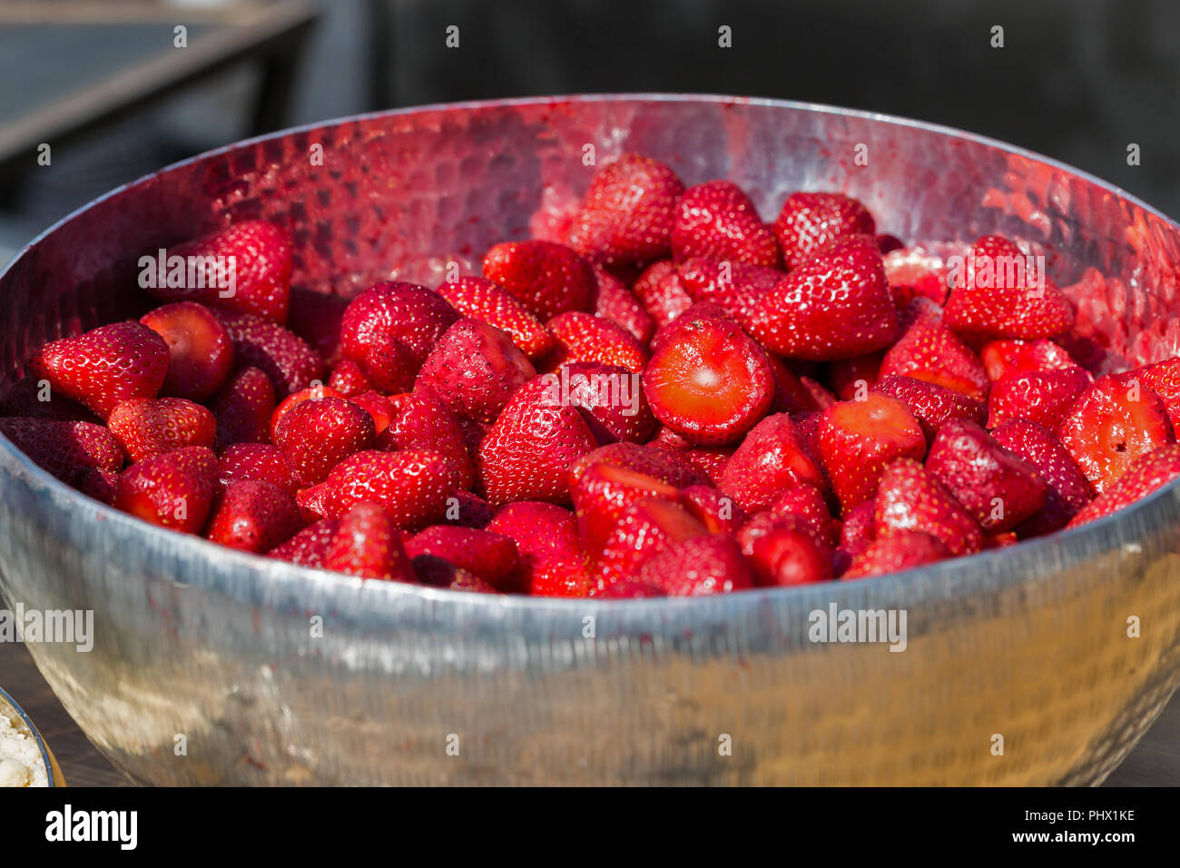 fresh ripe peeled strawberry in a metal bowl closeup Stock Photo - Alamy