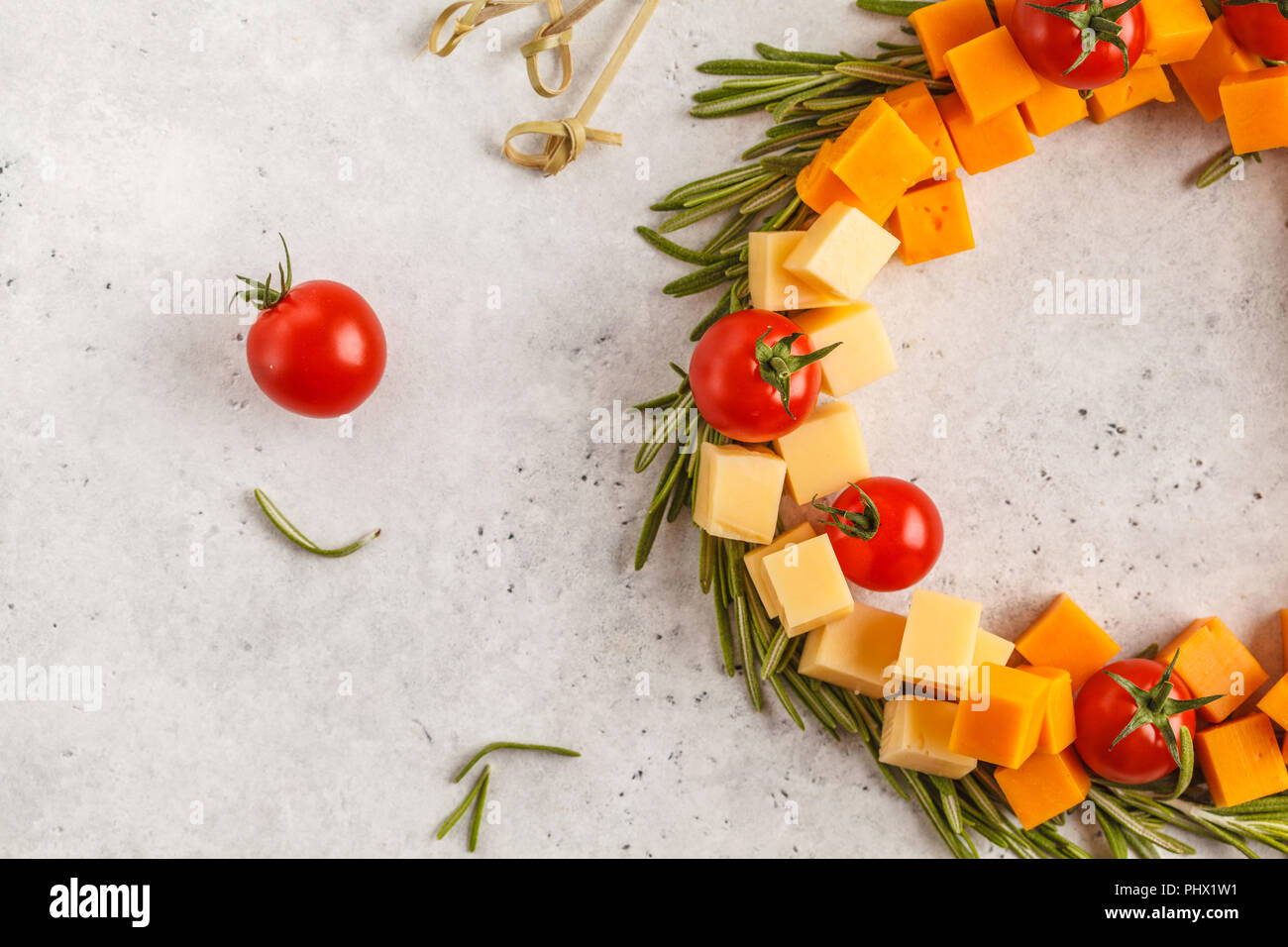 Christmas wreath of snacks made of cheese and tomatoes. Christmas food ...